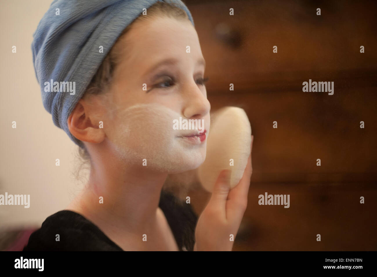 Young girl playing with make-up Stock Photo - Alamy