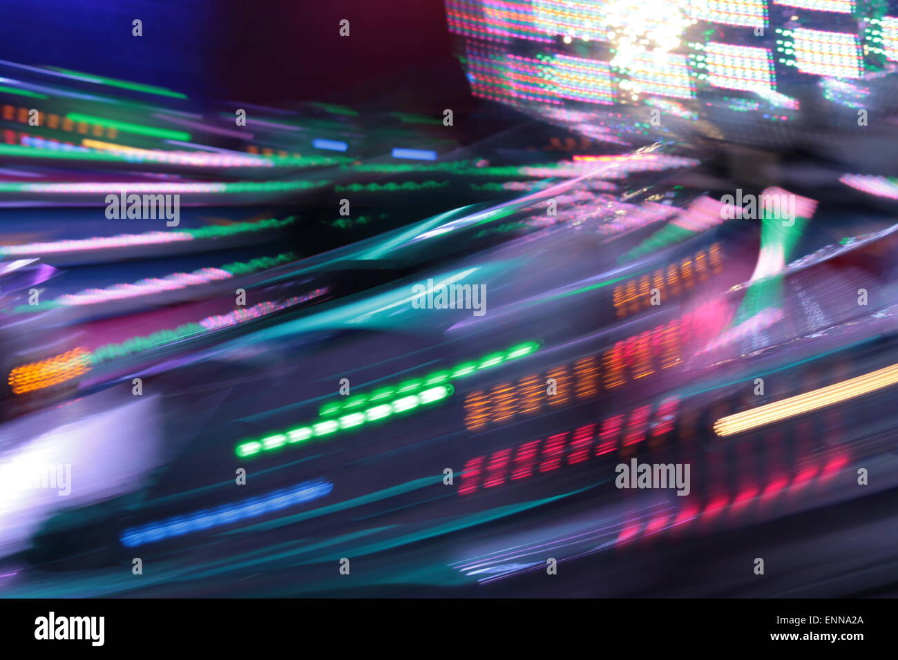 fairground funfair ride moving fast fair lights Night colours of the ...