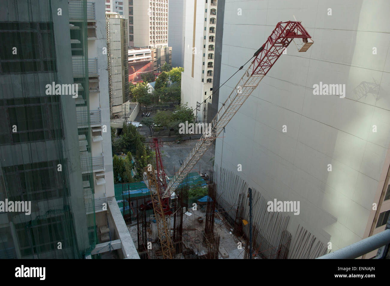 Crane working in between the high rise buildings of Salcedo Village ...