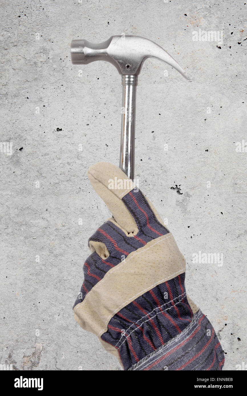 worker hand with a glove and hammer Stock Photo - Alamy