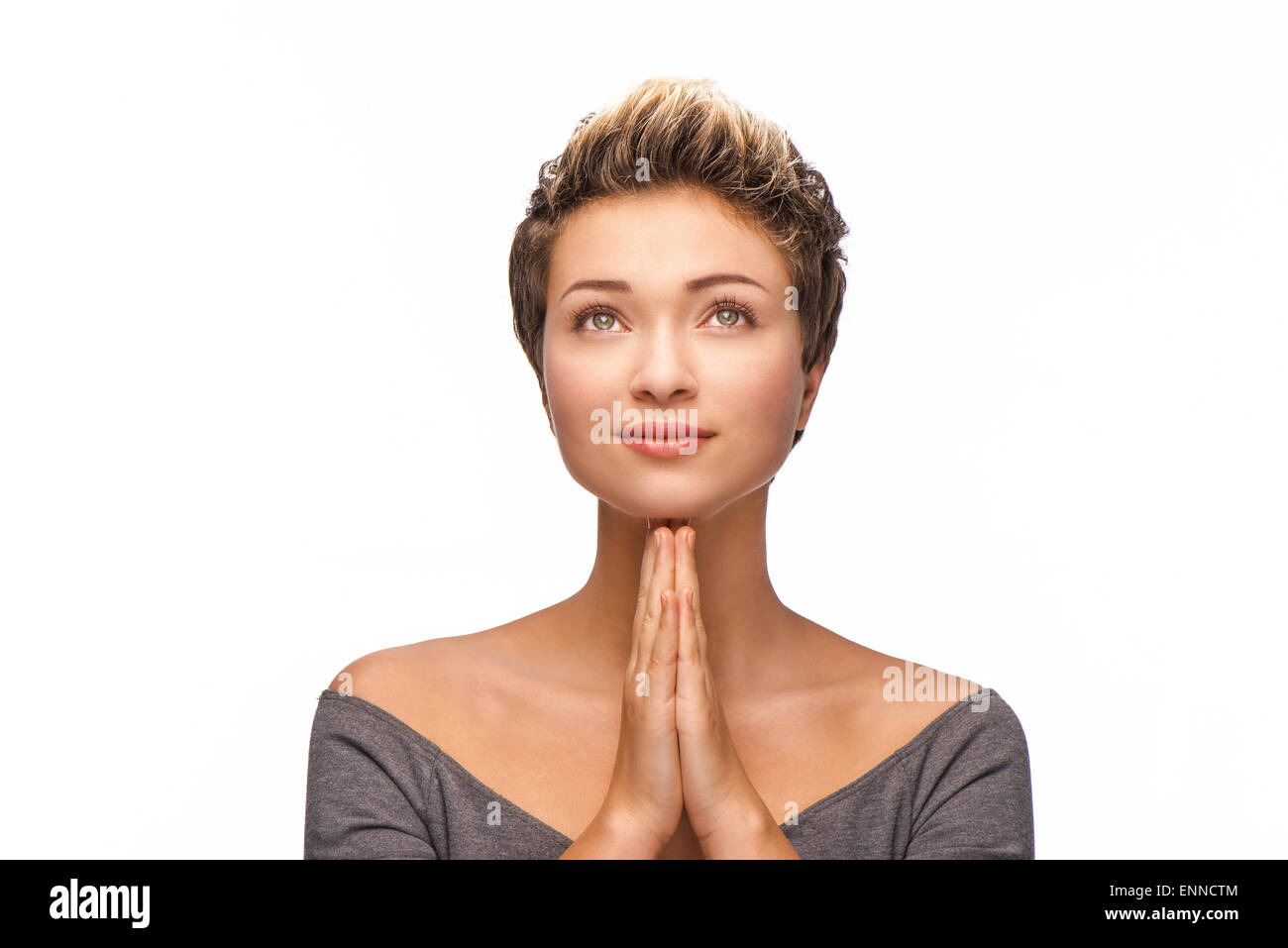Woman with copper-colored hair praying Stock Photo - Alamy