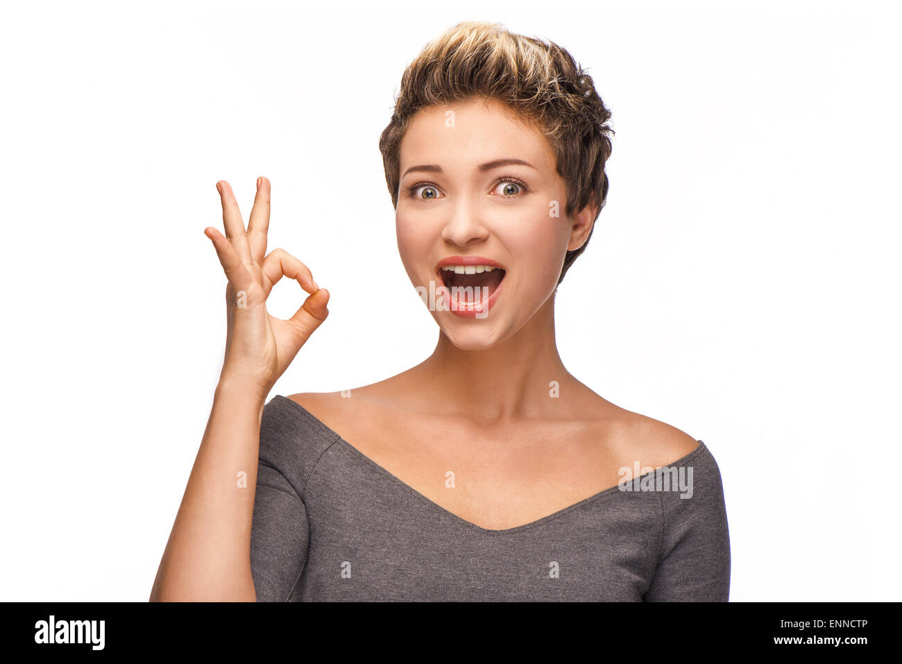 Beautiful young woman showing ok sign Stock Photo - Alamy
