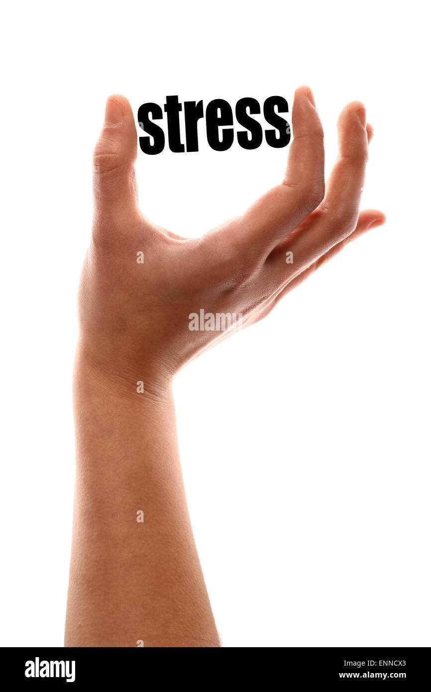 Color vertical shot of a hand squeezing the word "stress Stock Photo ...