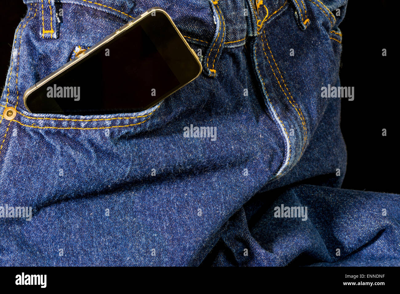 Blue denim jeans with a smart phone in the pocket Stock Photo - Alamy