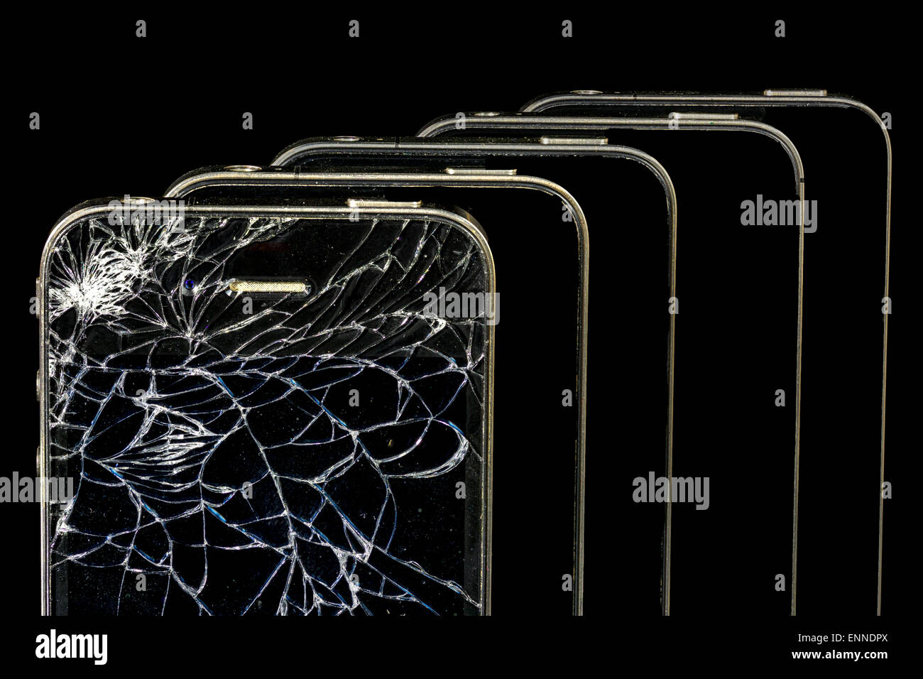 Many mobile phones with a single broken one Stock Photo - Alamy