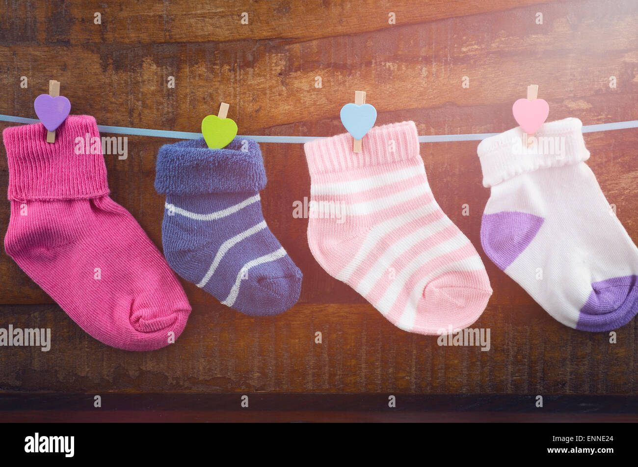 Happy Childrens Day concept with childrens socks hanging from pegs on a ...