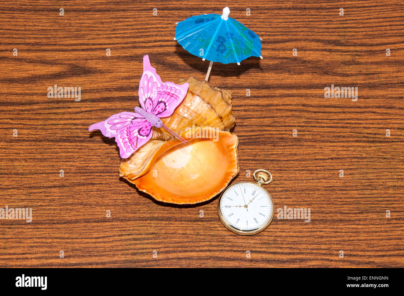 Seashell and hours of time to assemble in summer vacation Stock Photo ...
