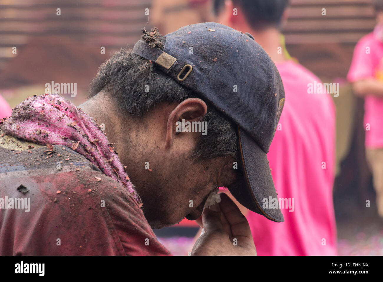 A man cleans his face from soot at the celebration of the goddess Mazu ...