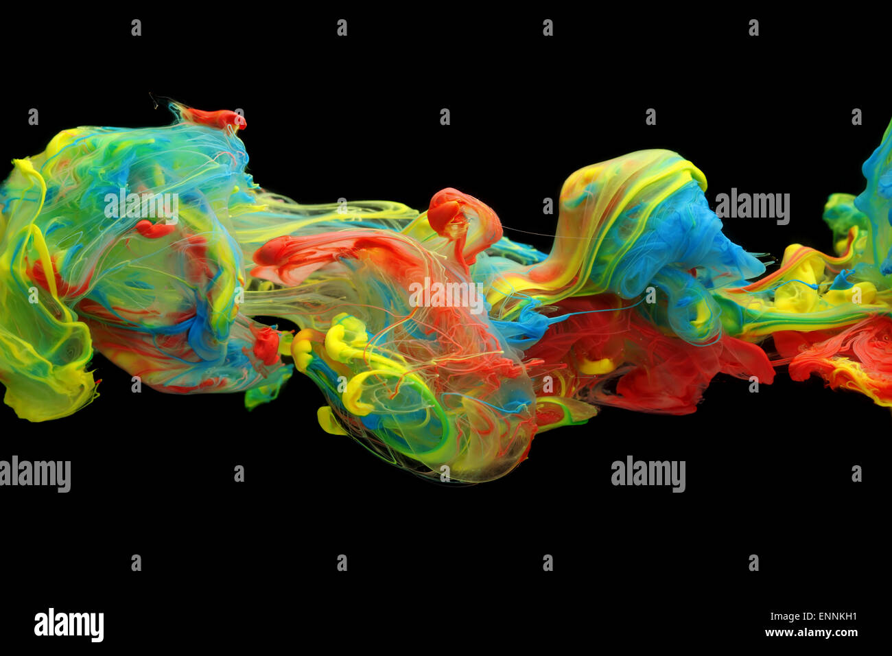 Colorful ink and paint swirling through water Stock Photo - Alamy