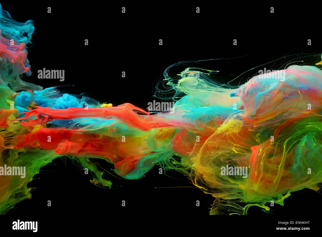 Clouds of bright colorful ink mixing in water Stock Photo - Alamy