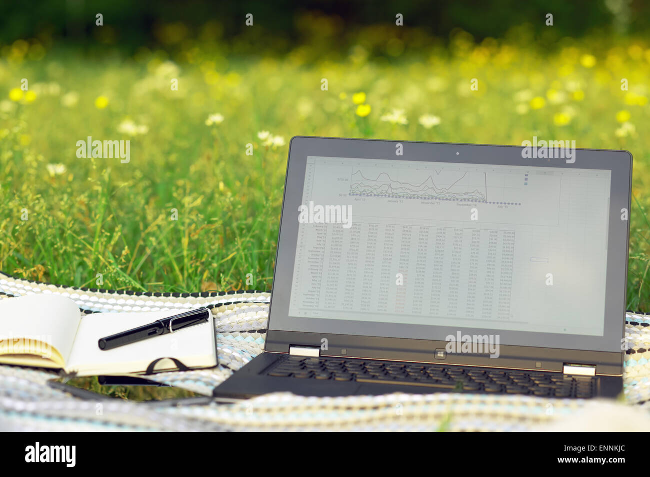 Outdoor office with laptop and notebook Stock Photo - Alamy