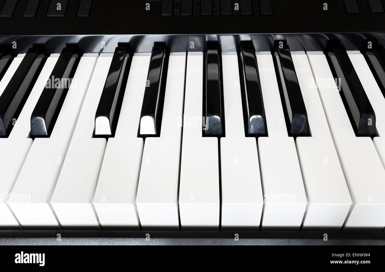 front view of black and white keys of musical digital keyboard close up ...