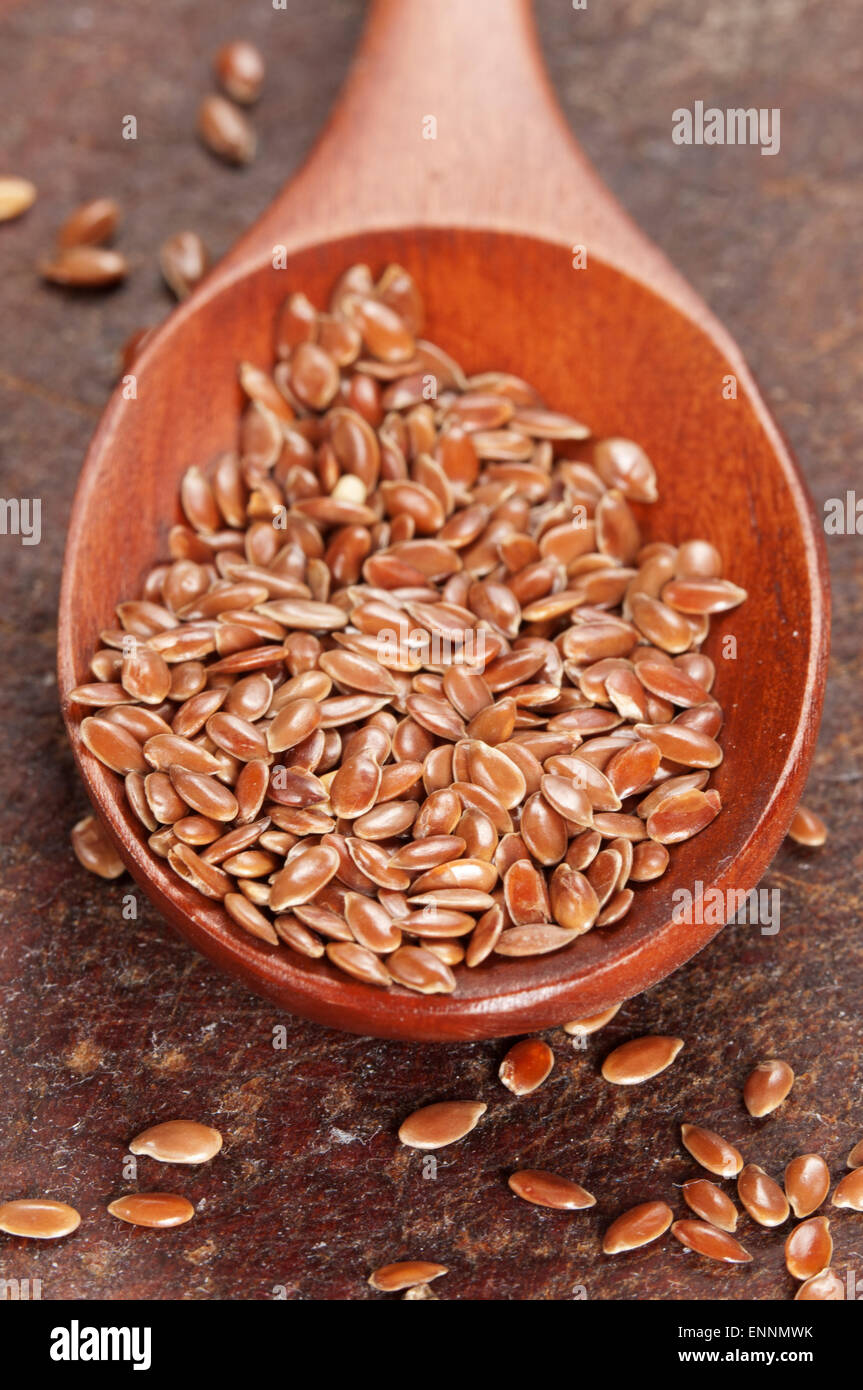 Flax seeds in a timber spoon, closeup shot Stock Photo - Alamy
