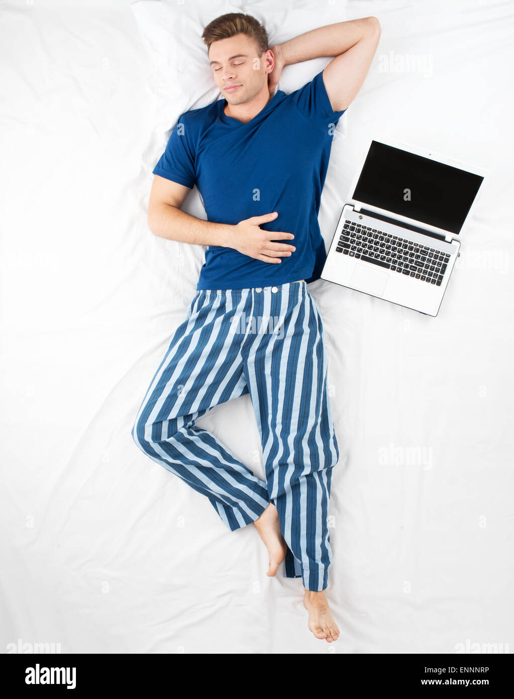 Top view photo of sleeping man with laptop Stock Photo - Alamy