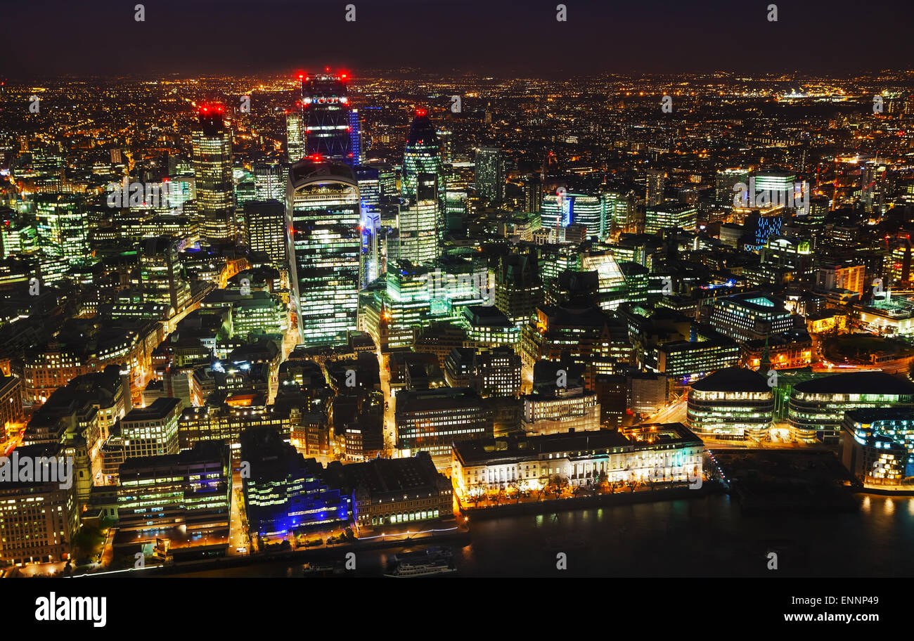 Aerial overview of the City of London financial ddistrict at night ...