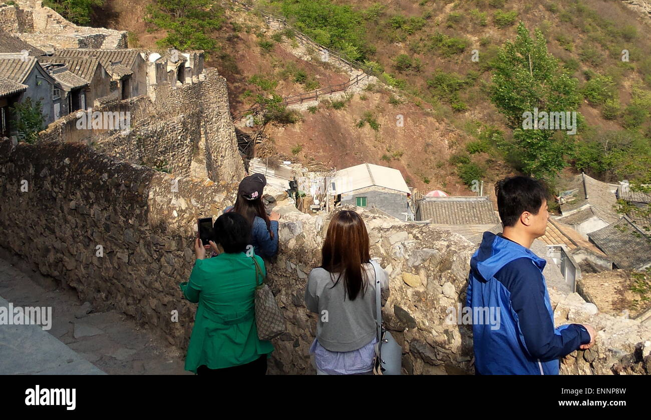 Beijing, China. 9th May, 2015. Tourists visit Chuandixia village on the ...