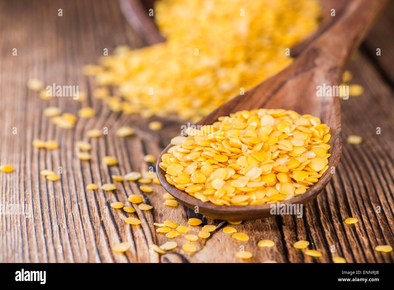 Yellow Lentils (detailed close-up shot) on wooden background Stock ...
