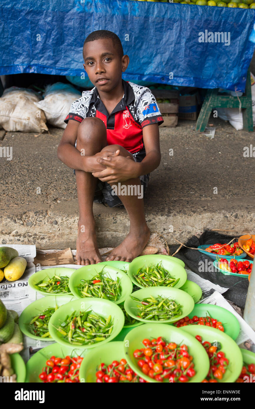 Young boy selling Chili peppers. Suva fruit and vegetable market. Suva ...