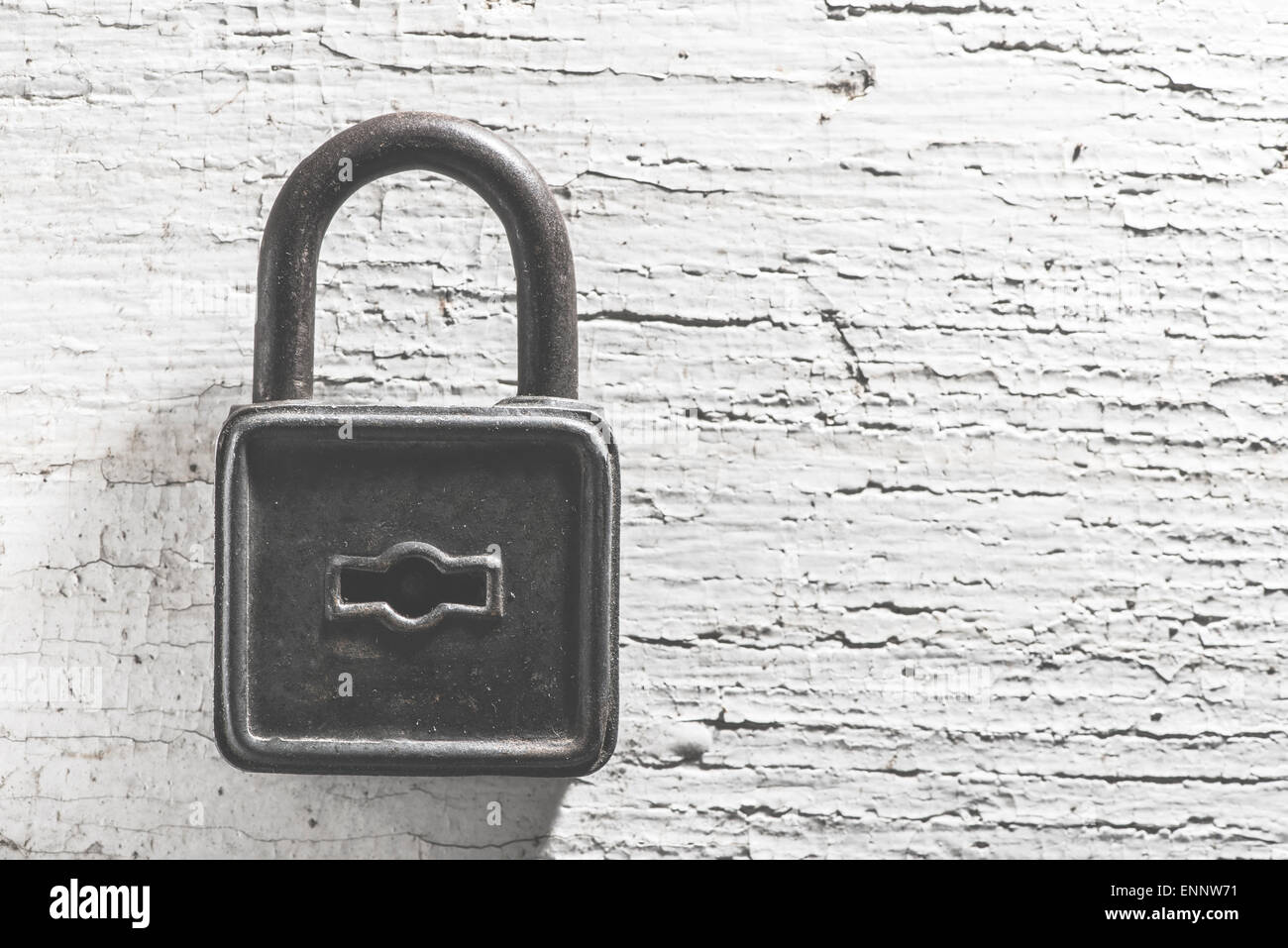 Old vintage padlock on wooden background Stock Photo - Alamy