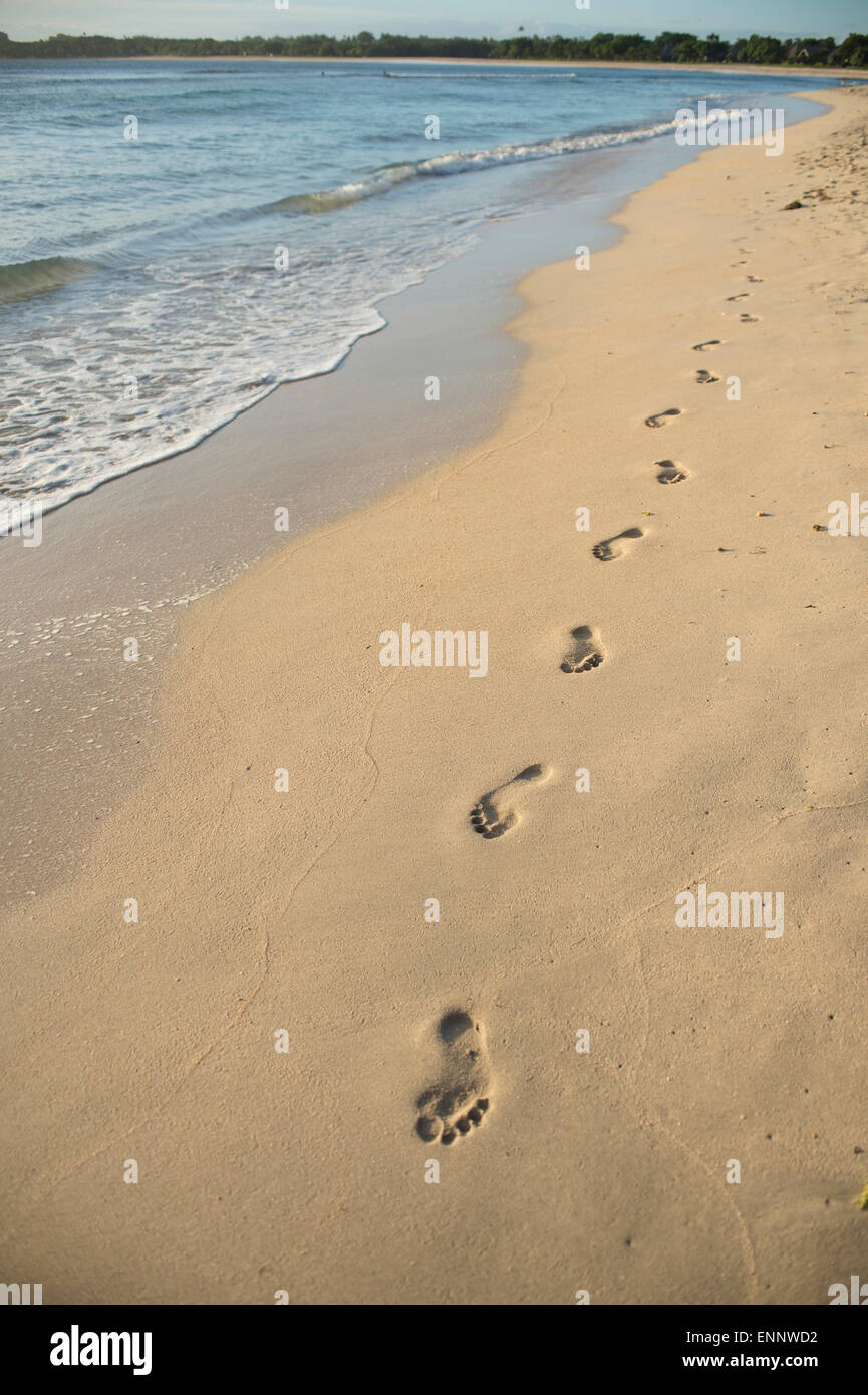 Footsteps along the beach Stock Photo - Alamy