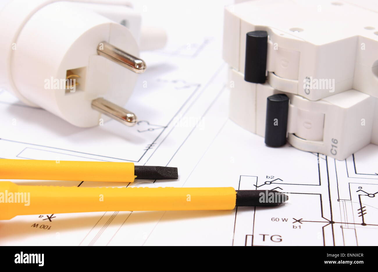 Screwdriver, work tools, electric plug and fuse lying on construction ...