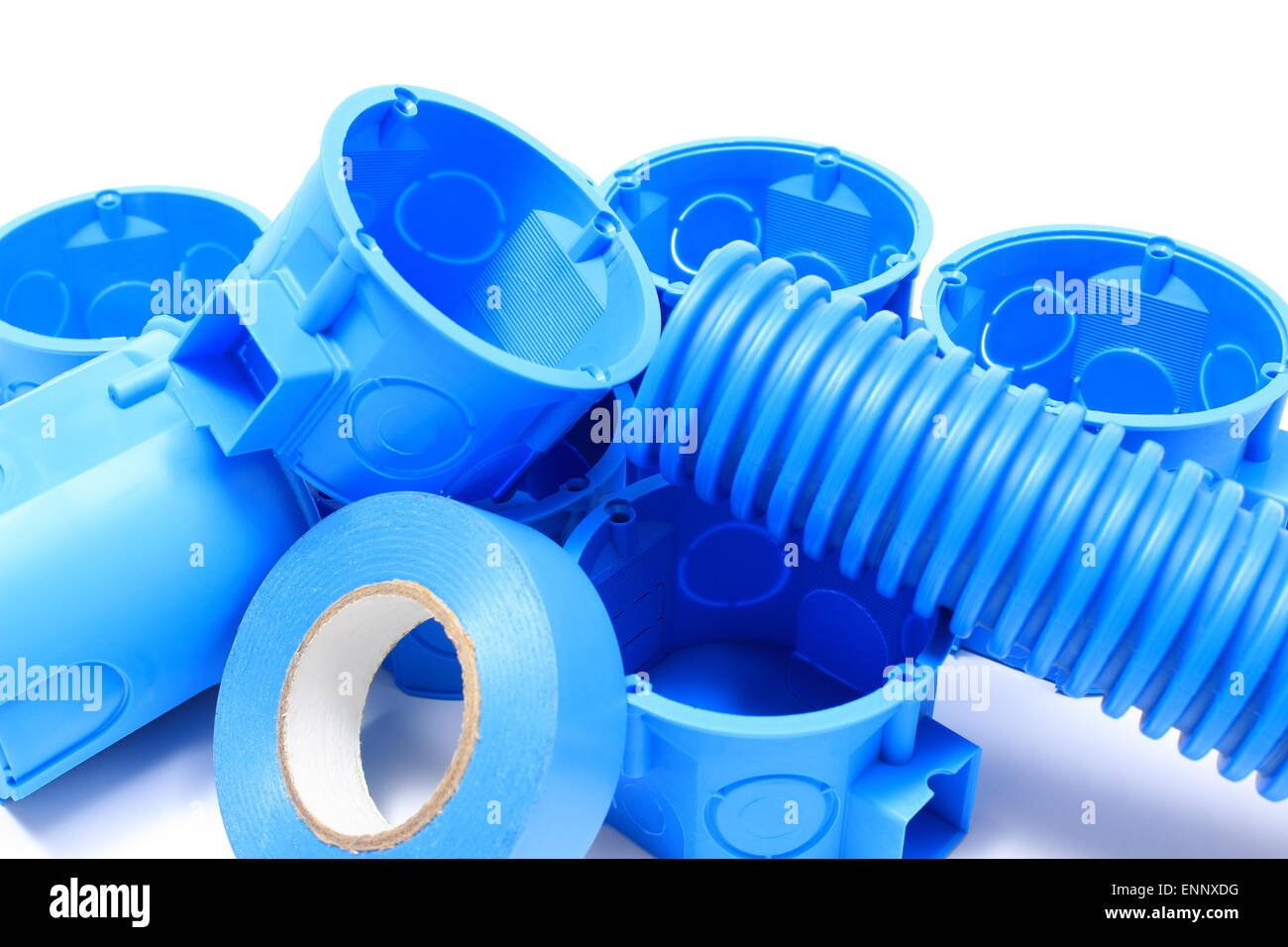 Heap of blue electrical boxes and components for use in electrical ...