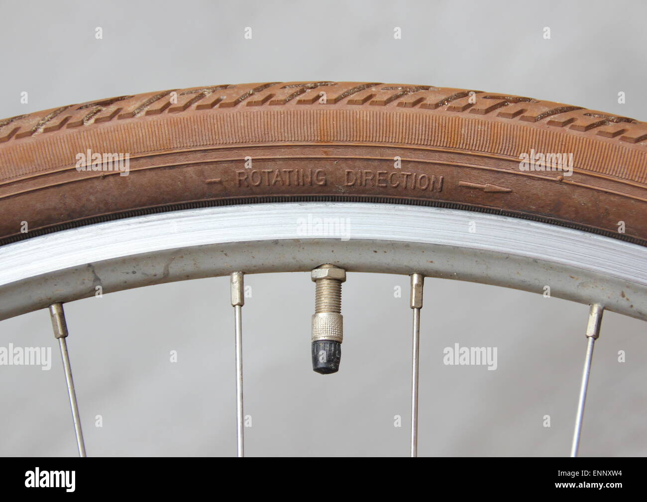 Rotate direction on bike wheel with valve Stock Photo - Alamy
