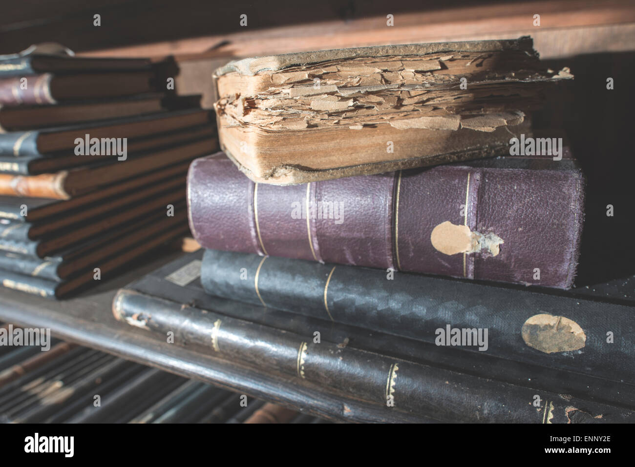 Old books in a vintage library shelves Stock Photo - Alamy