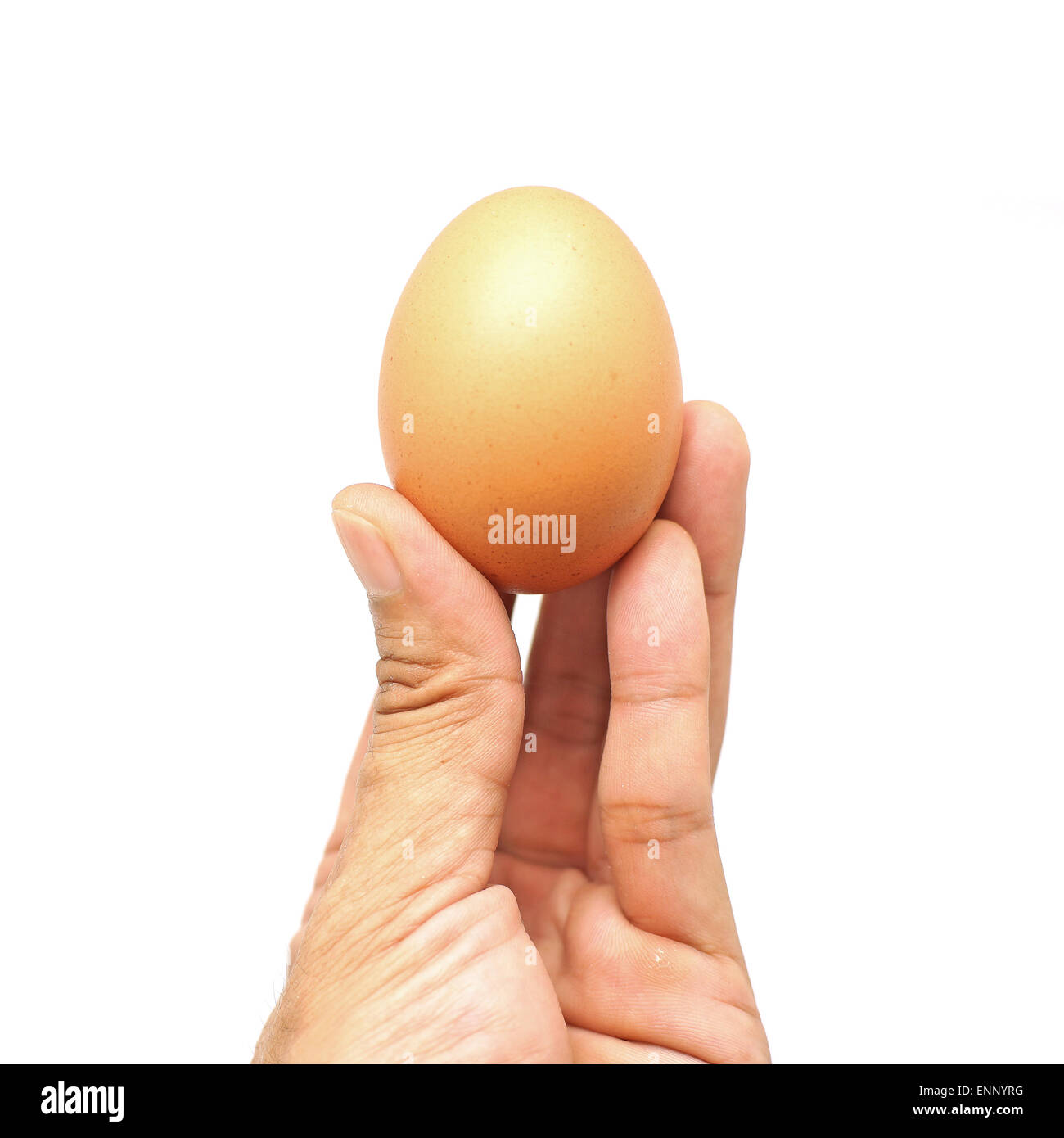 egg in male hand isolated on white background Stock Photo - Alamy