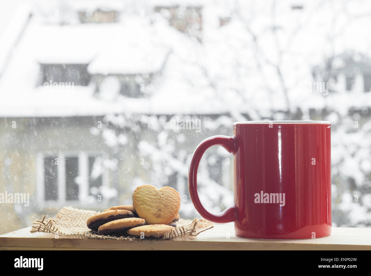 Red cup of coffee on a beautiful snow winter background Stock Photo - Alamy