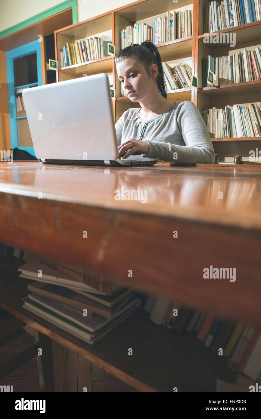 Student girl and laptop in a vintage library Stock Photo - Alamy