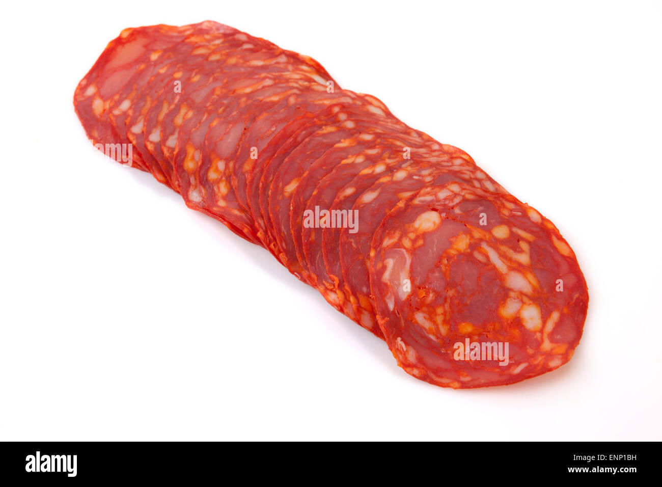 Some cut slices of red iberian chorizo. Isolated over white background ...