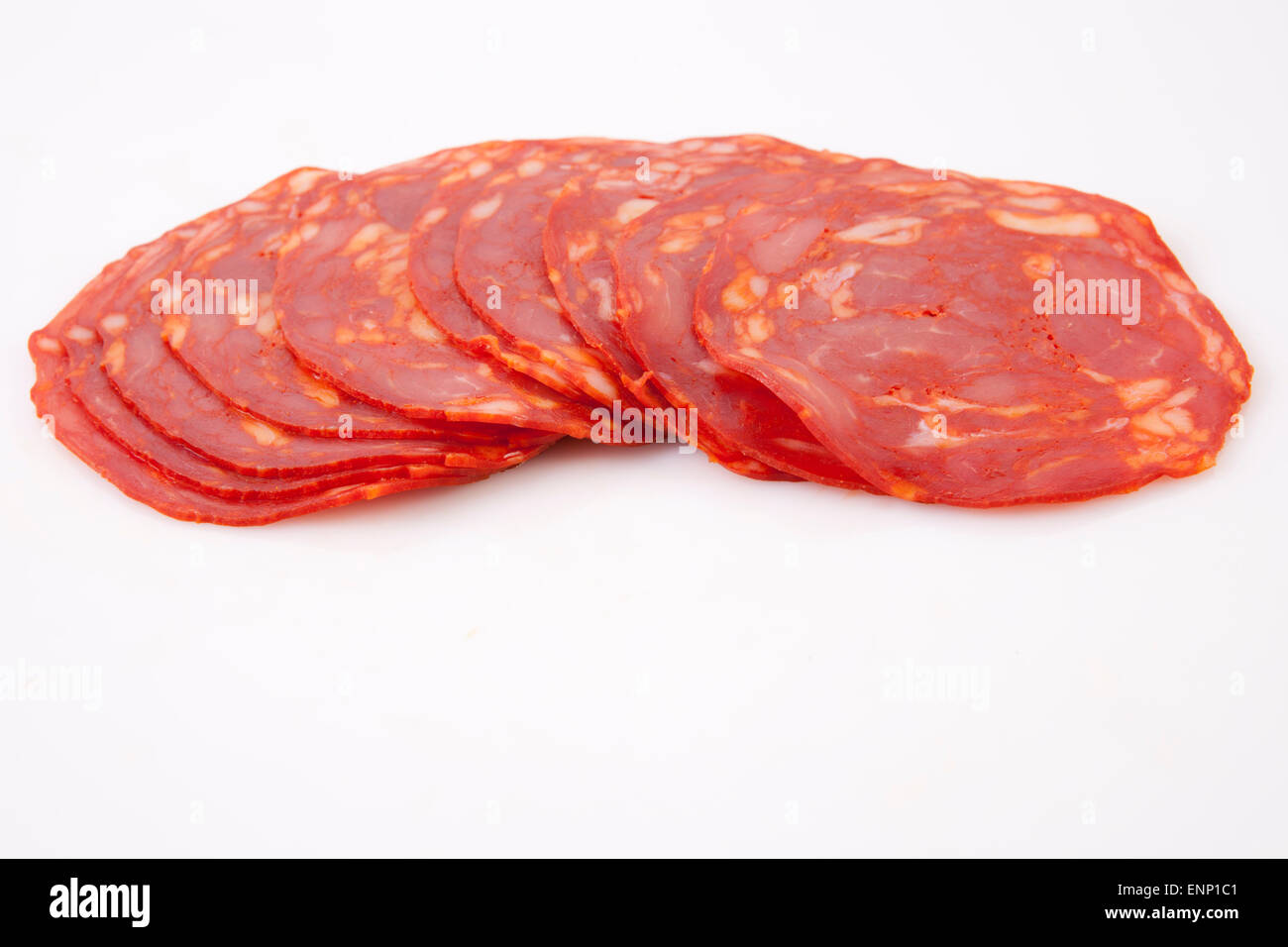 Some cut slices of red iberian chorizo. Isolated over white background ...