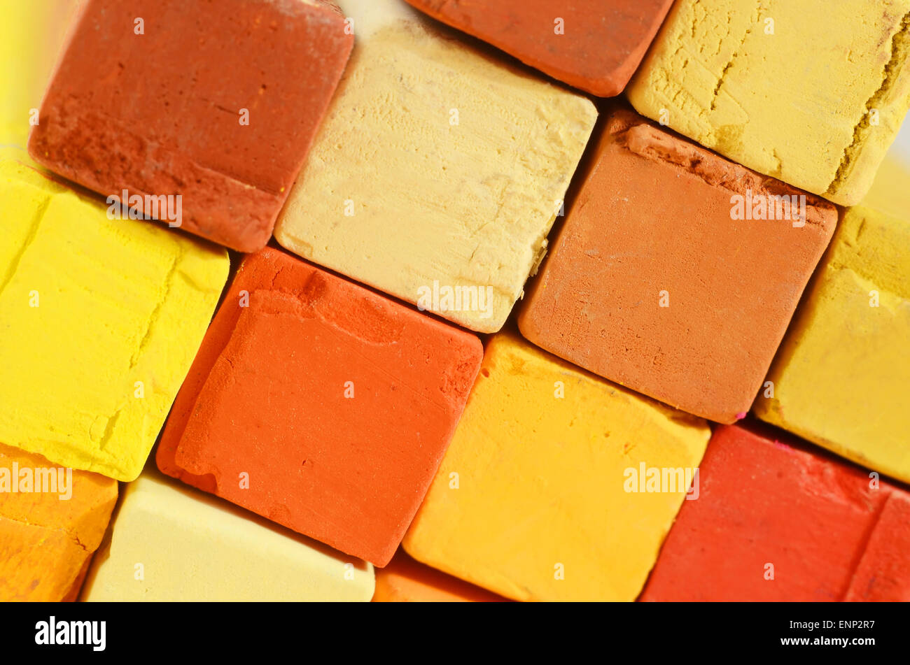 Creative art background - closeup of bright pastel crayons with yellow ...