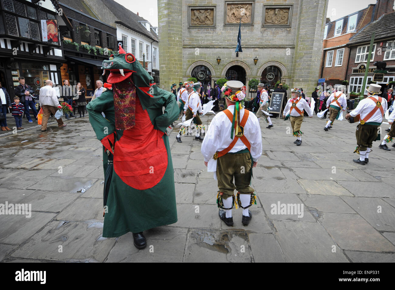 A Morris man dressed in a dragon costume entertains the crowd during ...