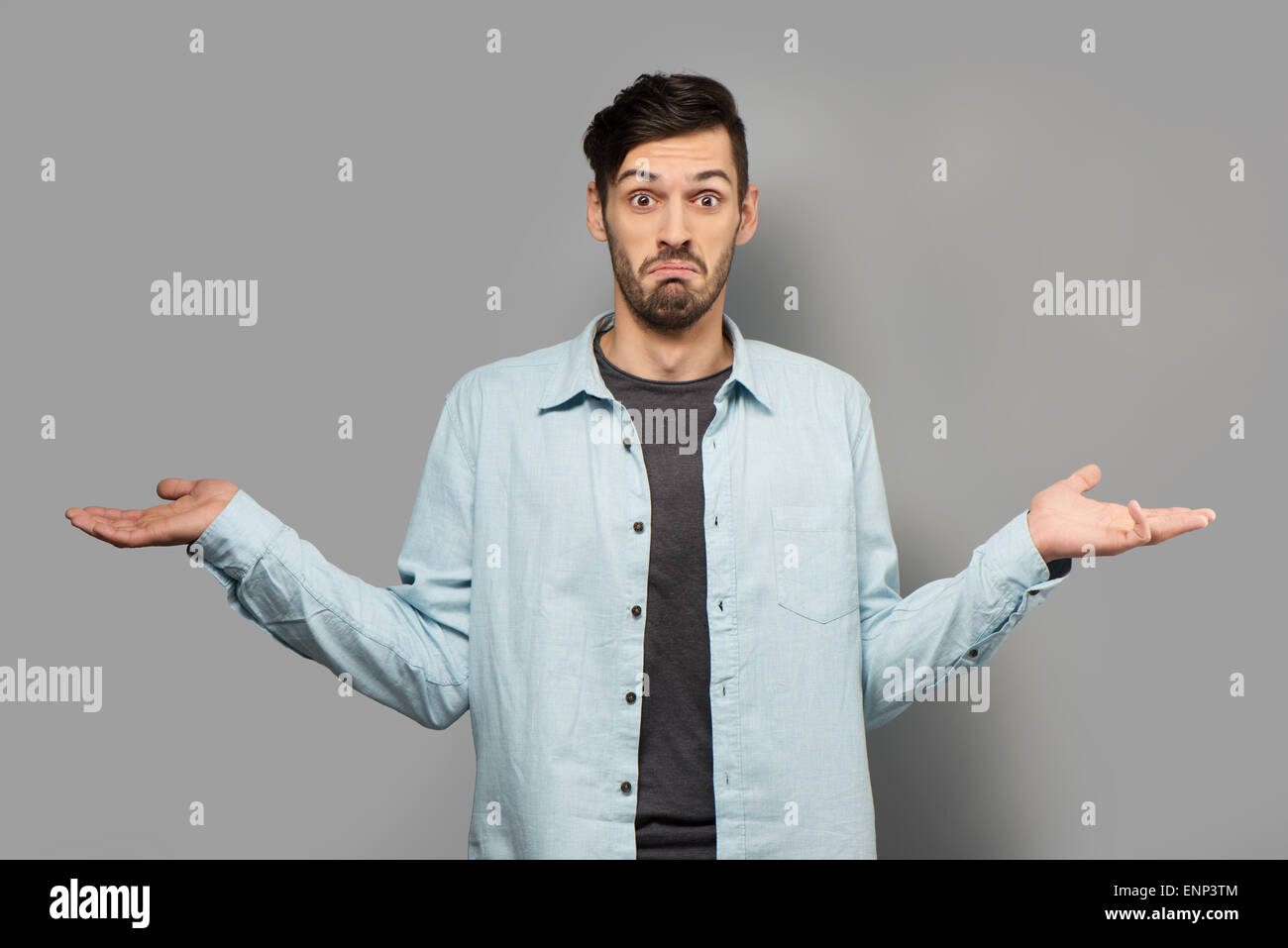 Young man spreading his hands Stock Photo - Alamy