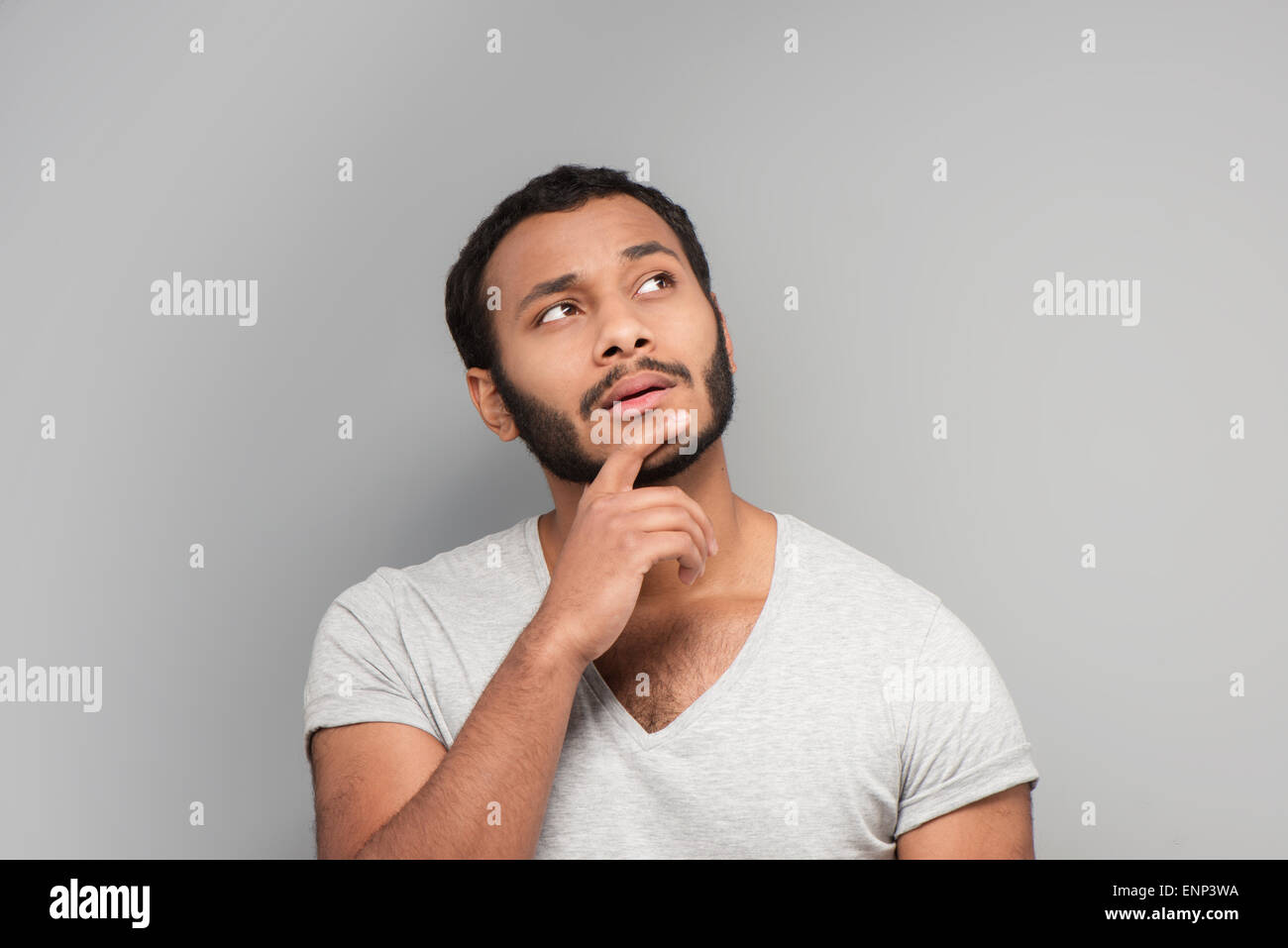 Young mixed race man looking up Stock Photo - Alamy