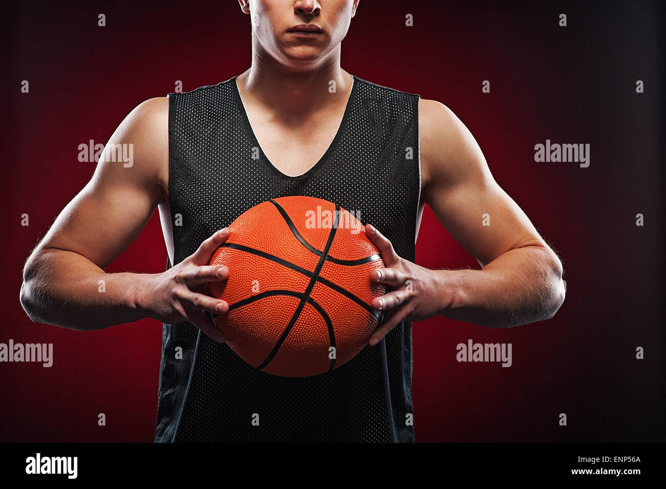 Male basketball athlete gripping the ball Stock Photo - Alamy