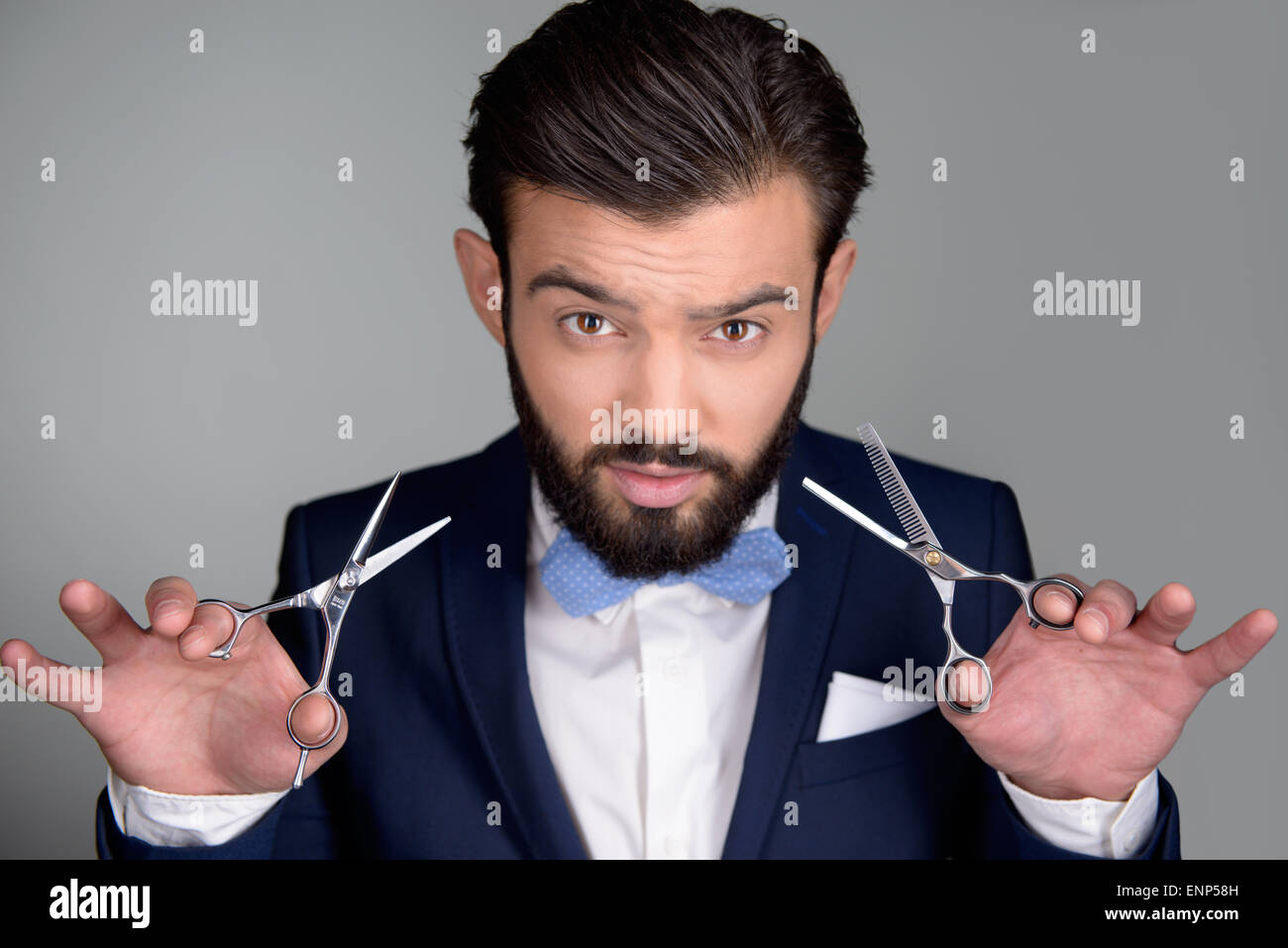 Standing holding scissors handsome hi-res stock photography and images ...