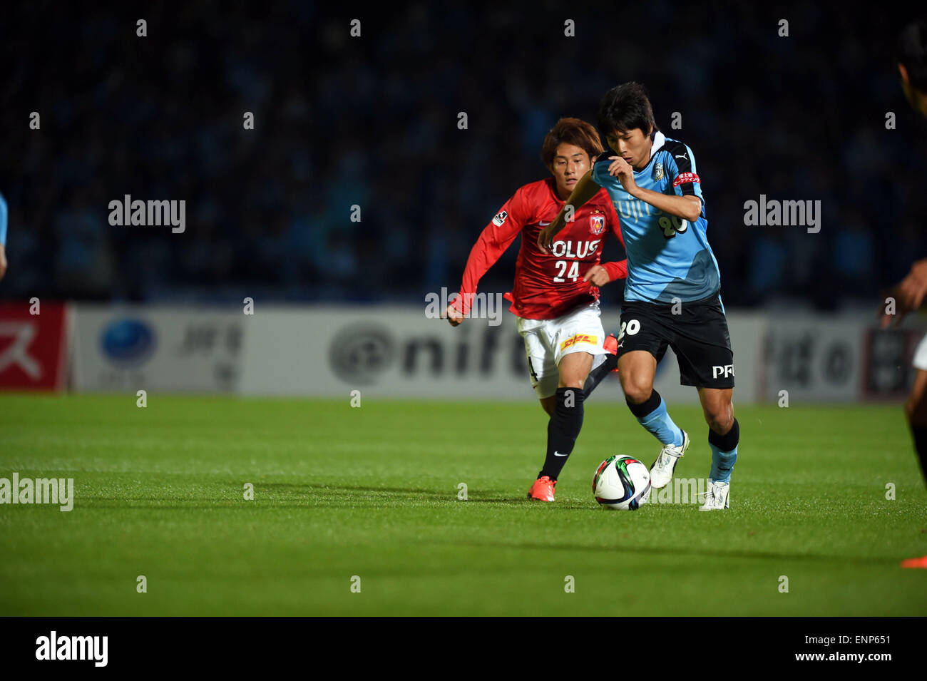 Kanagawa, Japan. 12th Apr, 2015. (F-B) Shintaro Kurumaya (Frontale), Takahiro Sekine (Reds ...