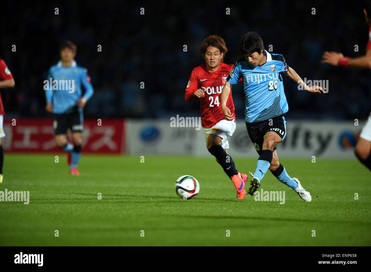Kanagawa, Japan. 12th Apr, 2015. (F-B) Shintaro Kurumaya (Frontale), Takahiro Sekine (Reds ...