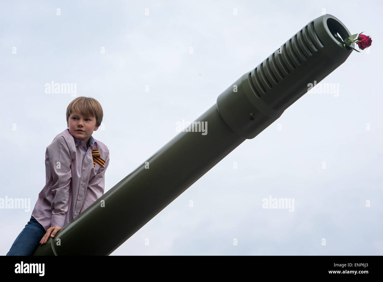 Berlin, Germany. 9th May, 2015. A child climbs on a tank model during a ...