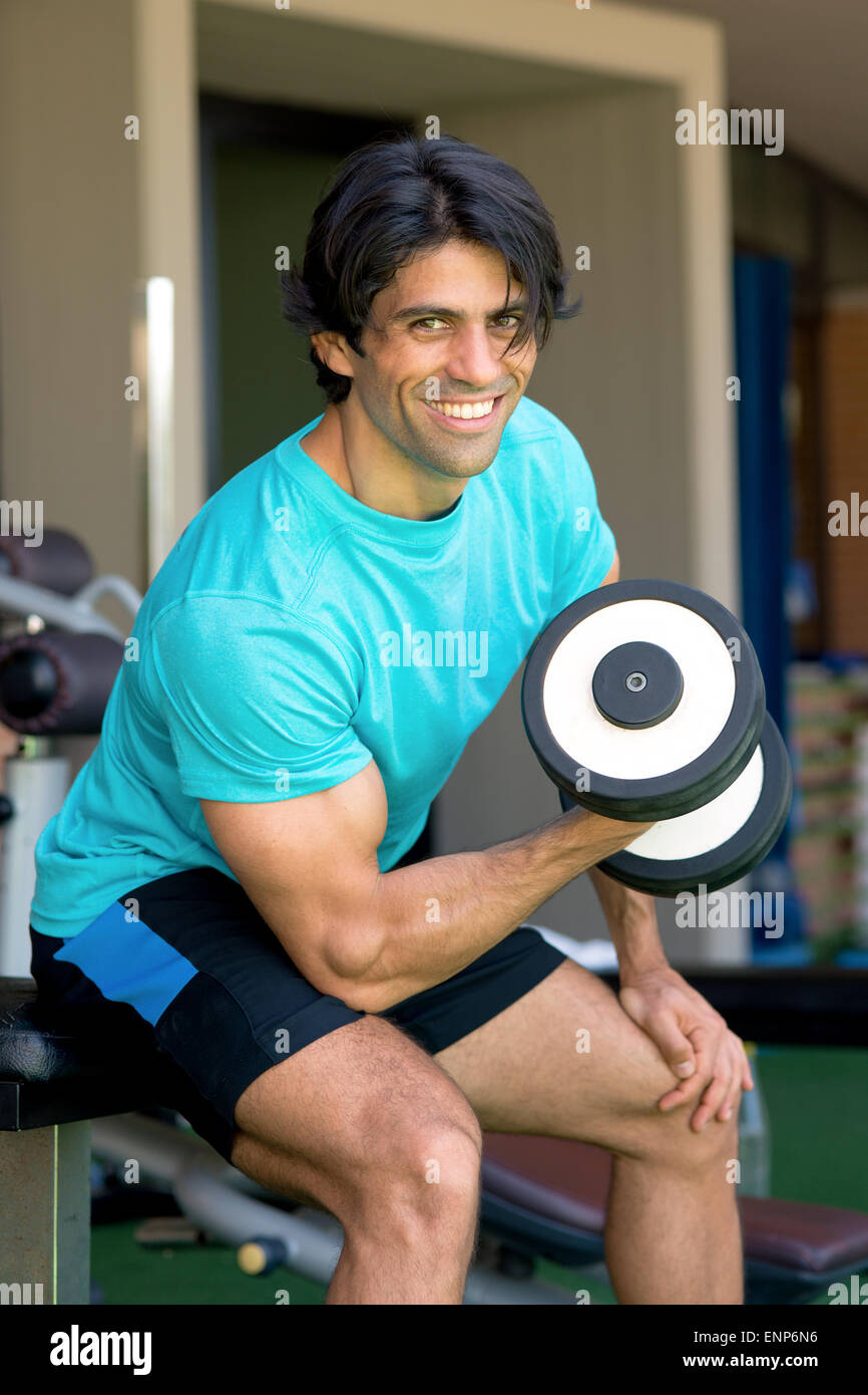 man doing exercises with barbells Stock Photo - Alamy