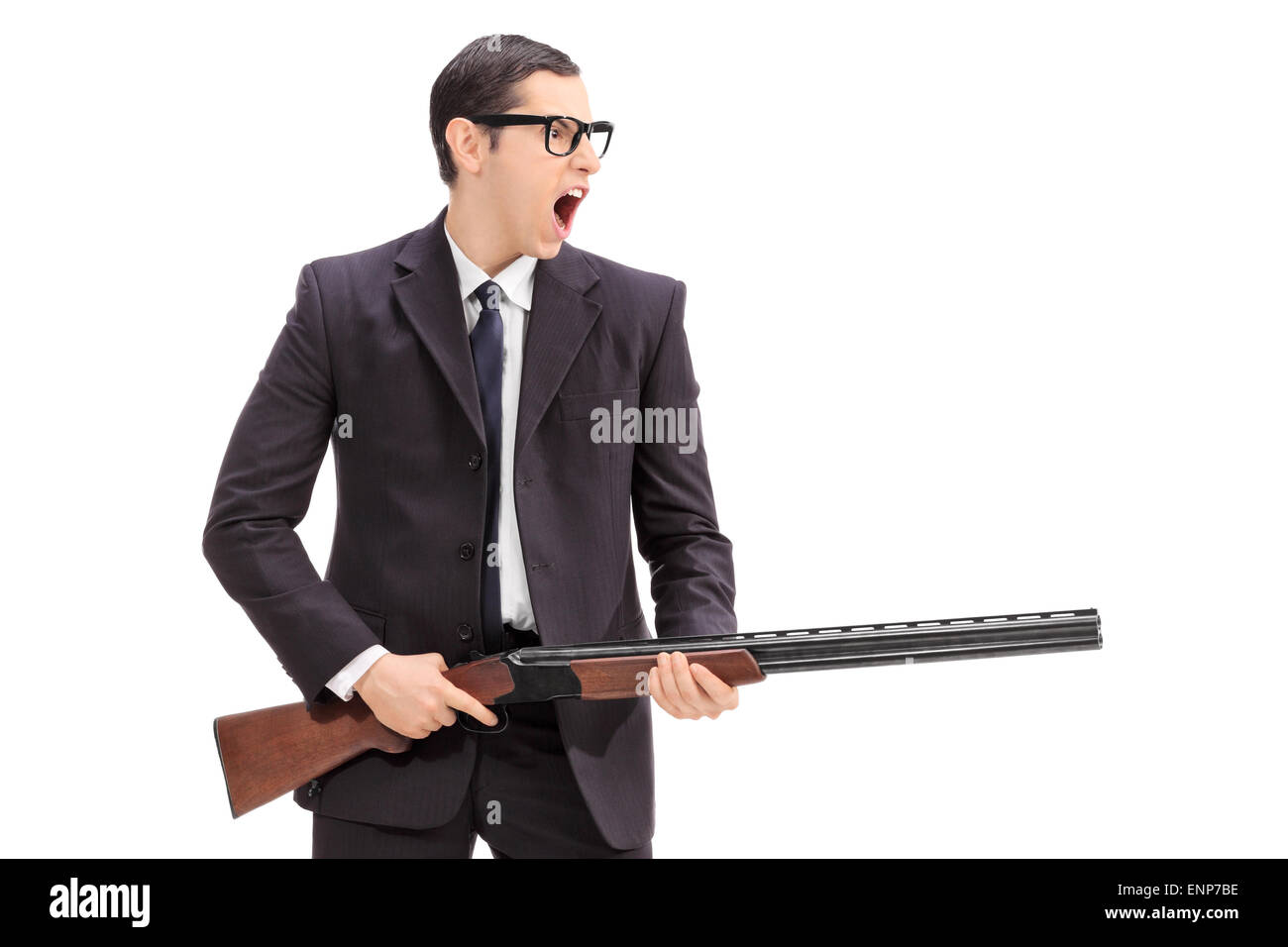 Angry man holding a rifle and shouting isolated on white background ...