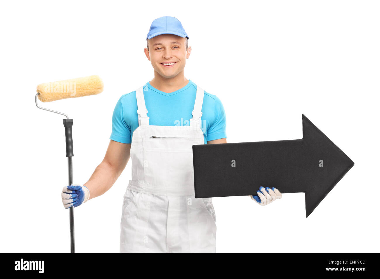 Young male decorator in a white uniform holding a paint roller and a ...