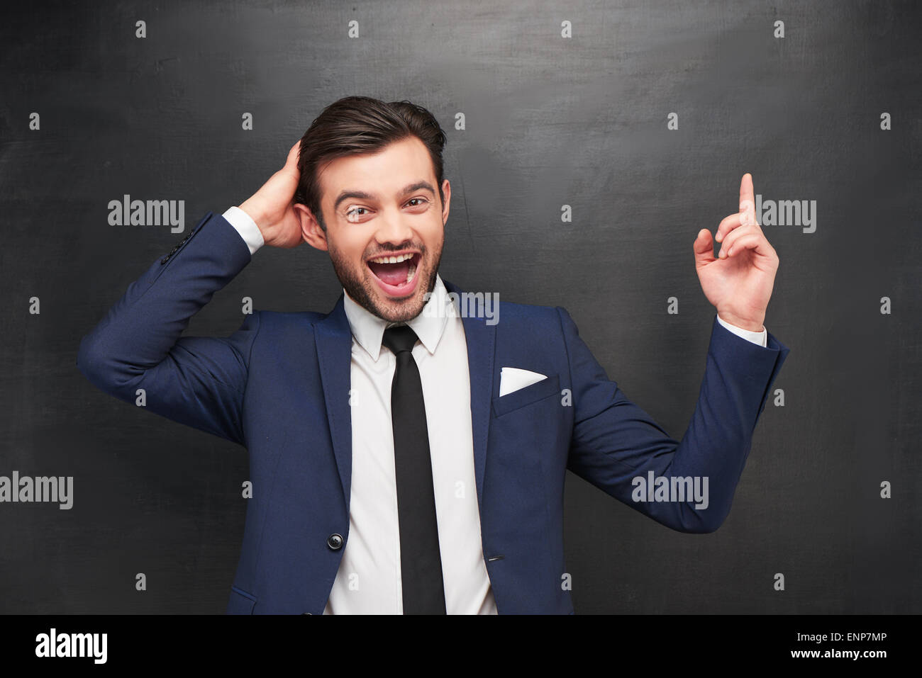 Young businessman pointing at chalkboard Stock Photo - Alamy