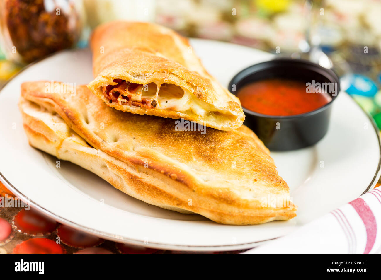 Freshly made Pepperoni calzone in Italian restaurant Stock Photo - Alamy