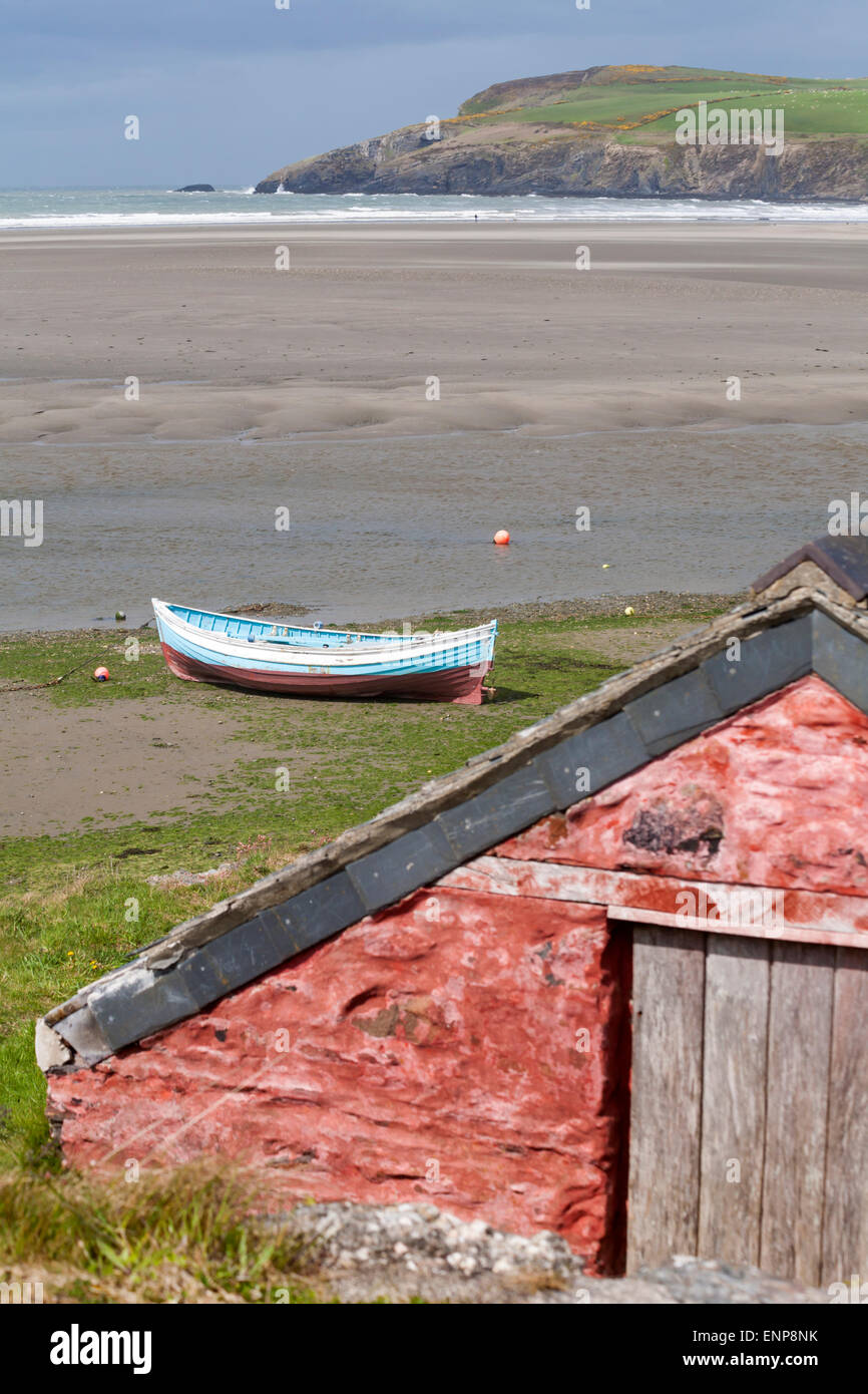 Cottage, boat and beach at The Parrog at the southern end of Newport ...