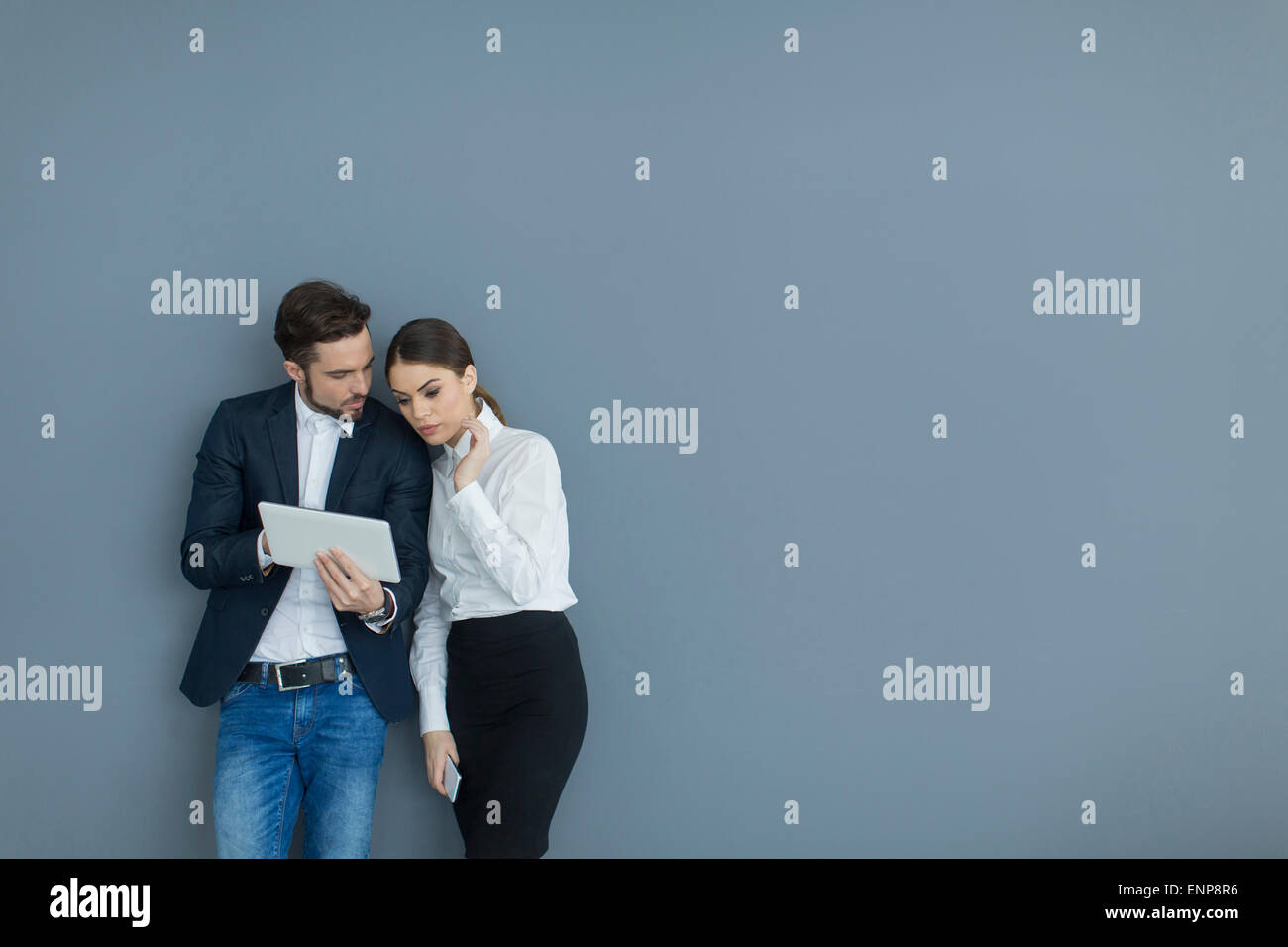 Young people with tablet in the office Stock Photo - Alamy