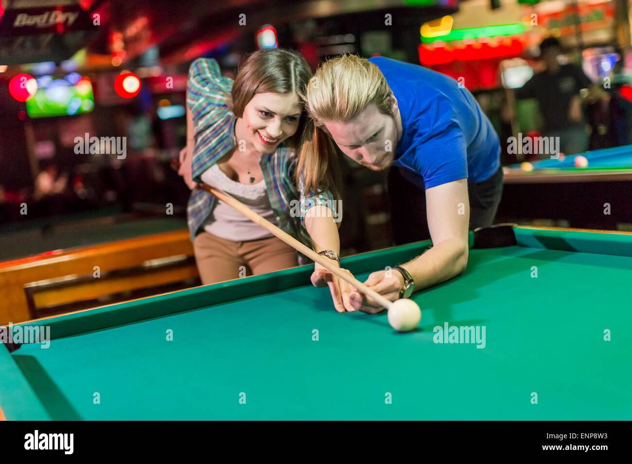Young couple playing pool Stock Photo - Alamy